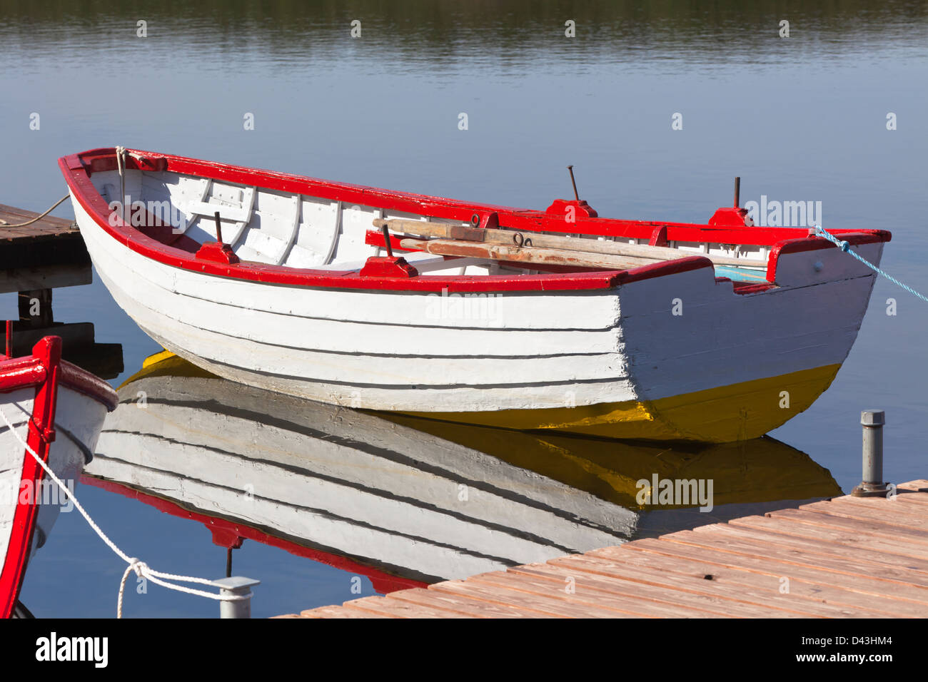 Floating White Wooden Boat with Reflection in a Water Stock Photo - Alamy