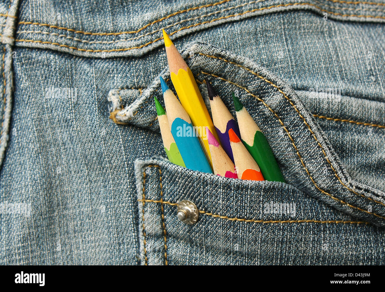 Color pencils in pocket Stock Photo - Alamy