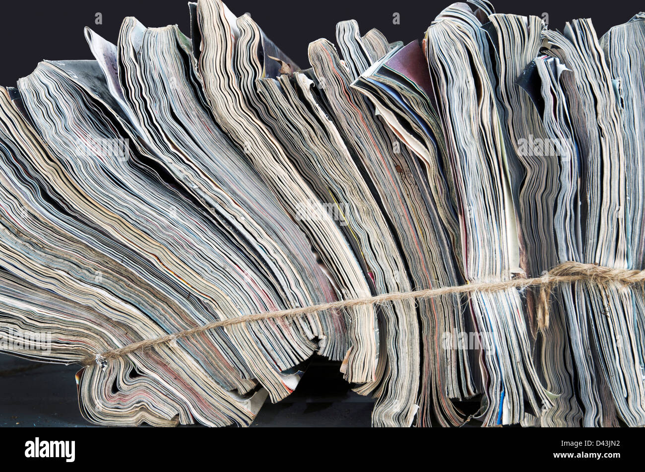 Magazines tied with twine for Recycling Stock Photo - Alamy