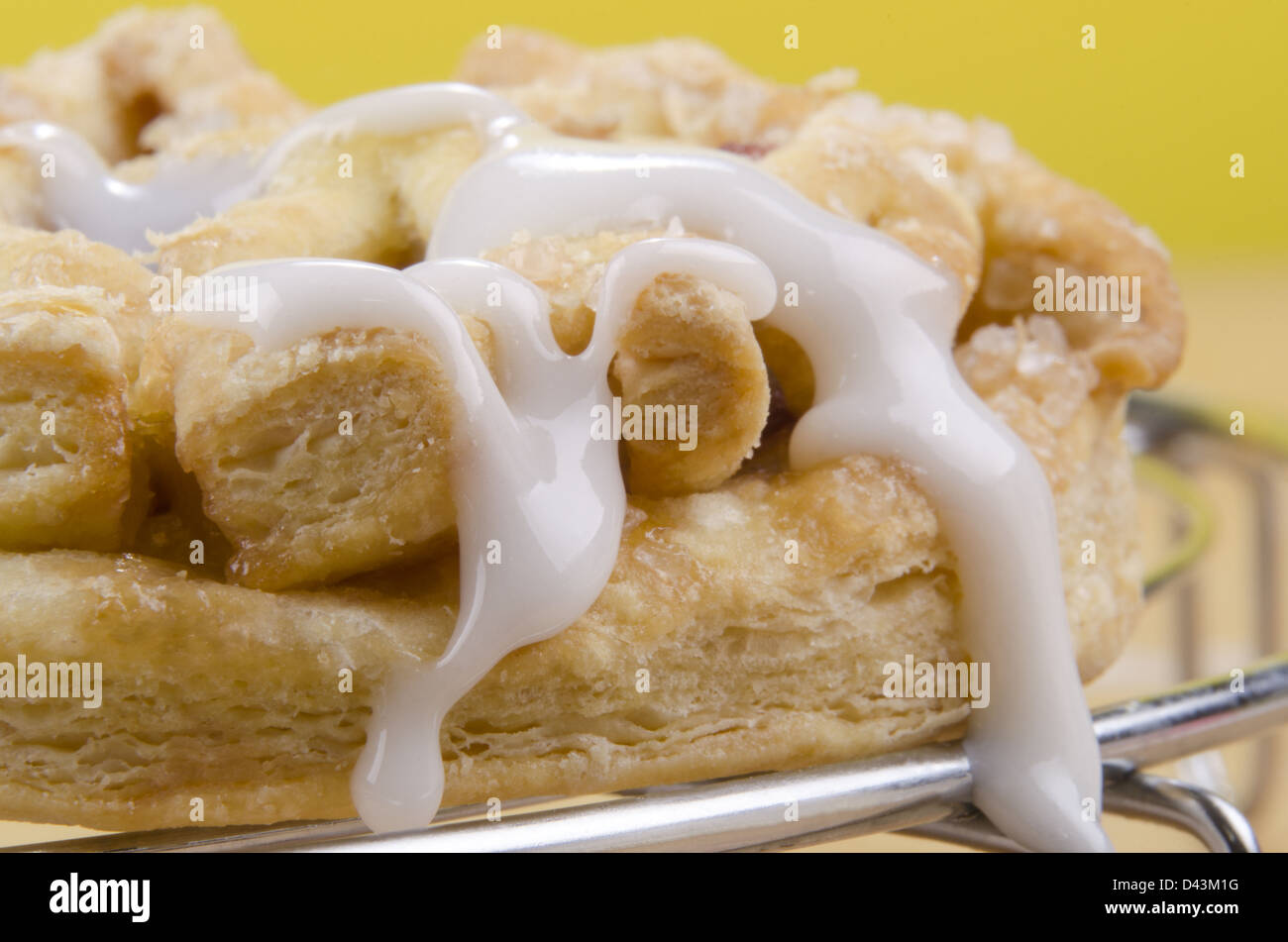 puff pastry with icing on a cooling rack Stock Photo - Alamy