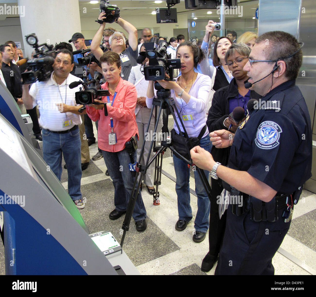 Global Entry program representatives and U.S. Customs and Border ...