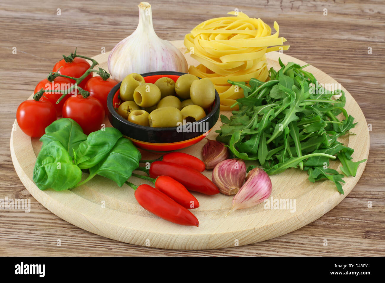 Selection of italian ingredients on wooden board Stock Photo - Alamy