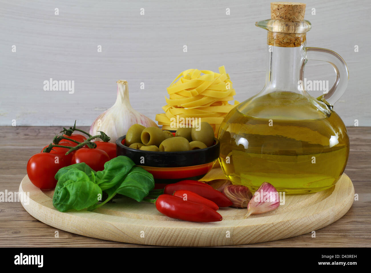 Selection of italian ingredients on wooden board Stock Photo - Alamy