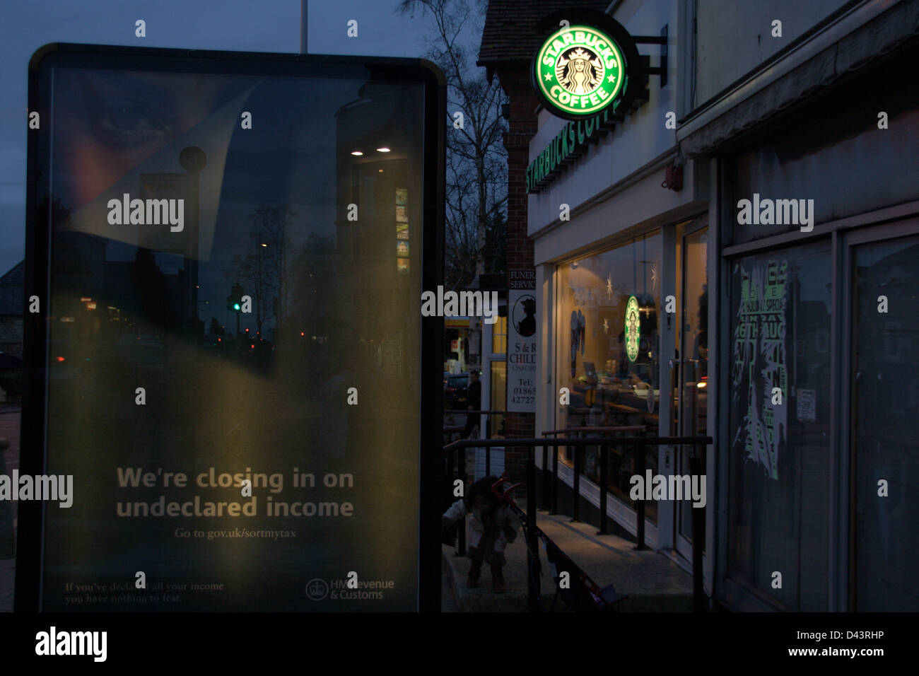 HMRC advert infront of starbucks shop in Headington, Oxford Stock Photo ...