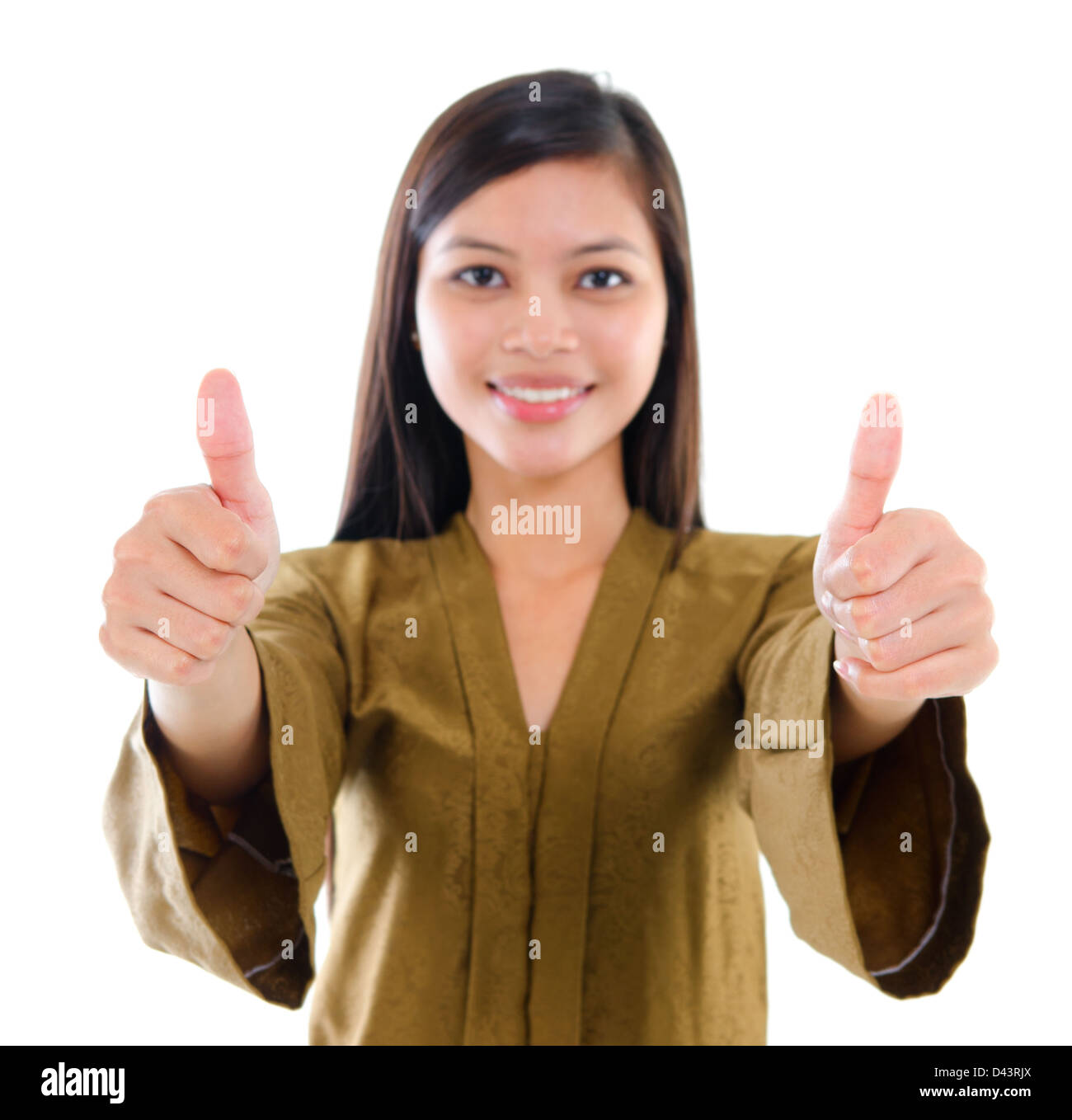 Portrait of a young attractive Southeast Asian muslim woman standing ...