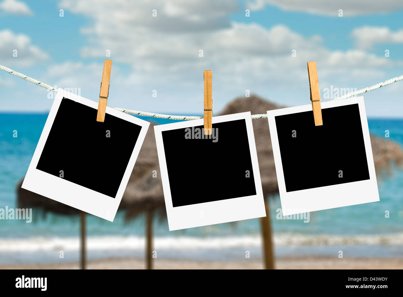 Pictures template hooked on a rope. Sky background Stock Photo - Alamy