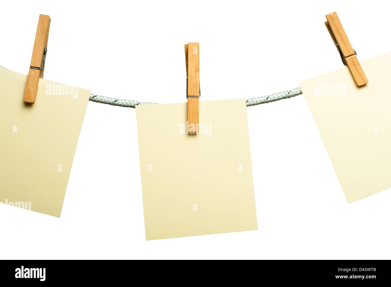 Note papers hooked on a rope. White isolated studio shot Stock Photo ...
