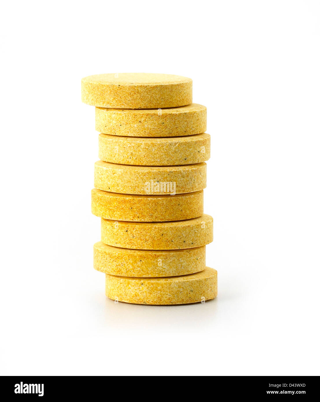 Stack of yellow tablets cut out white background Stock Photo - Alamy
