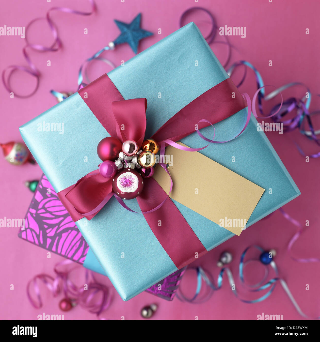 Wrapped up present pink background Stock Photo - Alamy