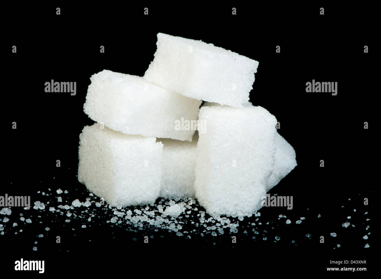 Sugar lumps black isolated. Studio shot Stock Photo - Alamy