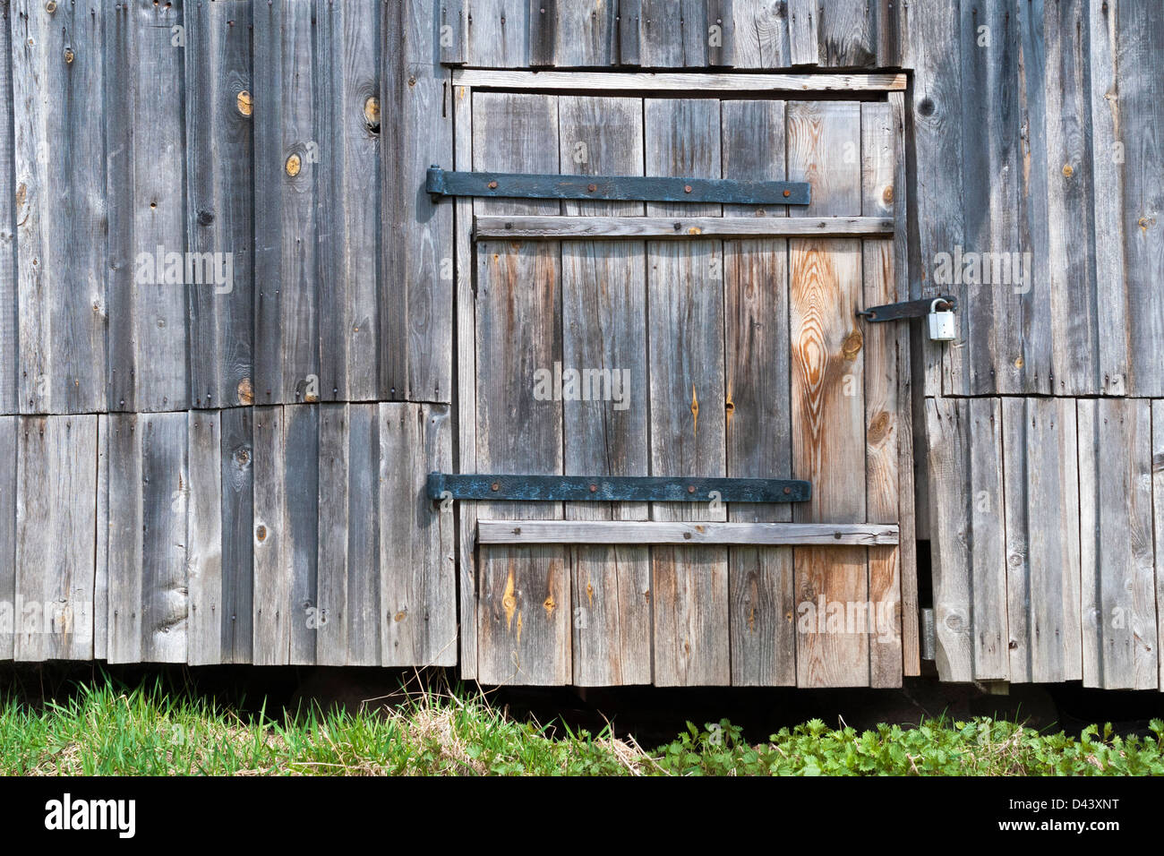 old barn wall with locked wooden door Stock Photo - Alamy