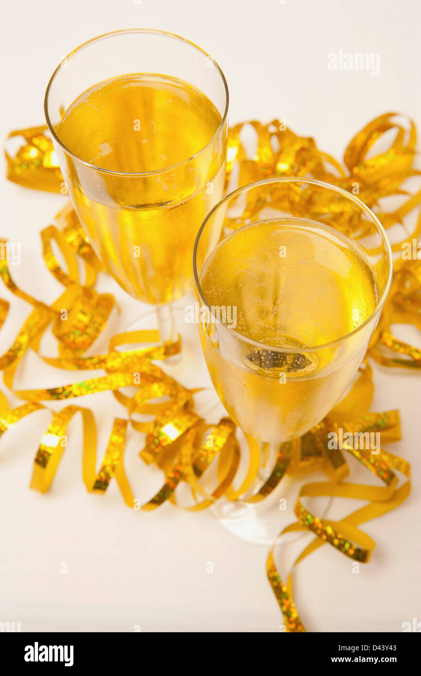 Two Glasses of Sparkling Wine and Streamers Stock Photo - Alamy