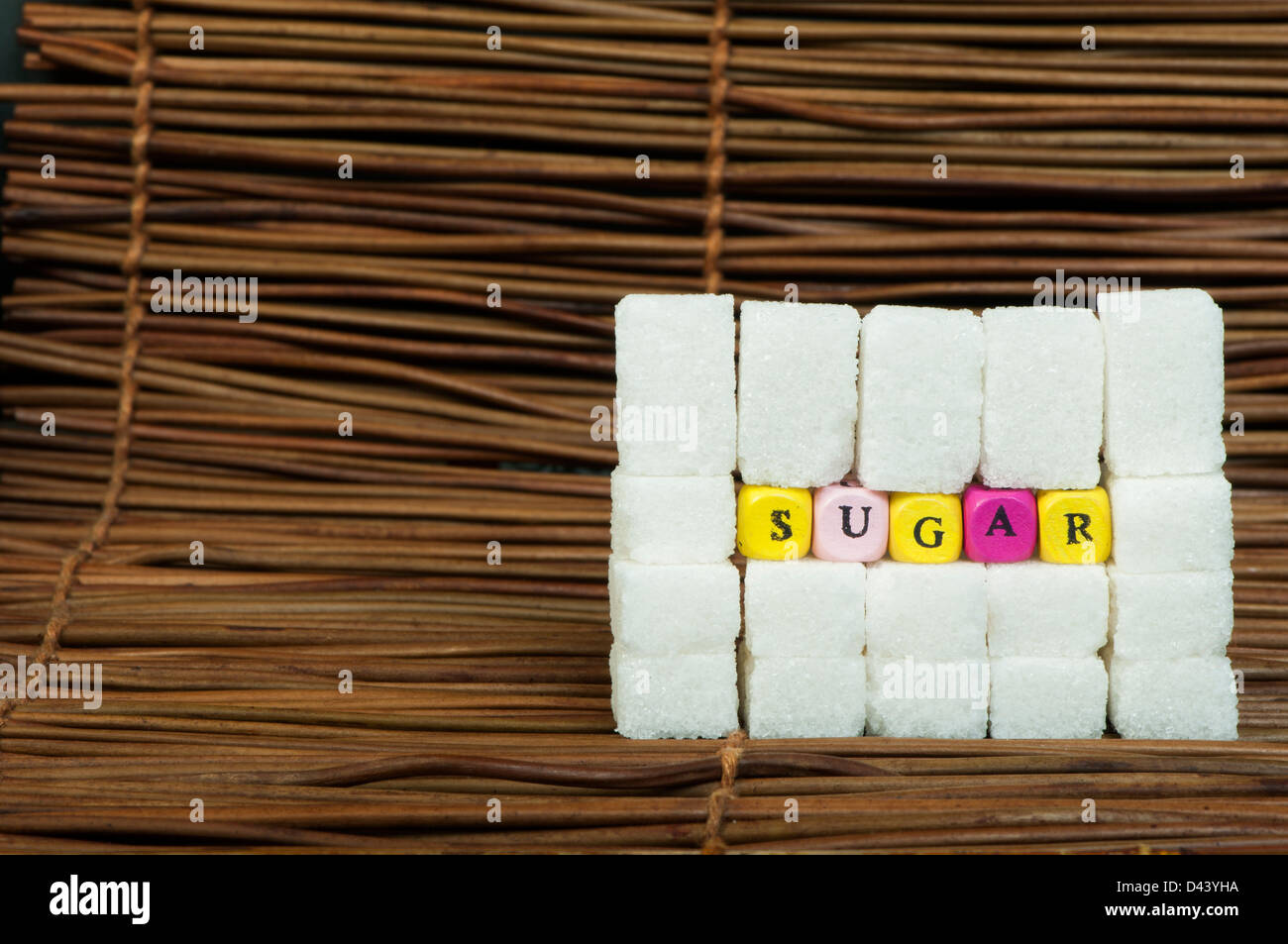 Sugar lumps and word sugar. Multicolored cubes Stock Photo - Alamy