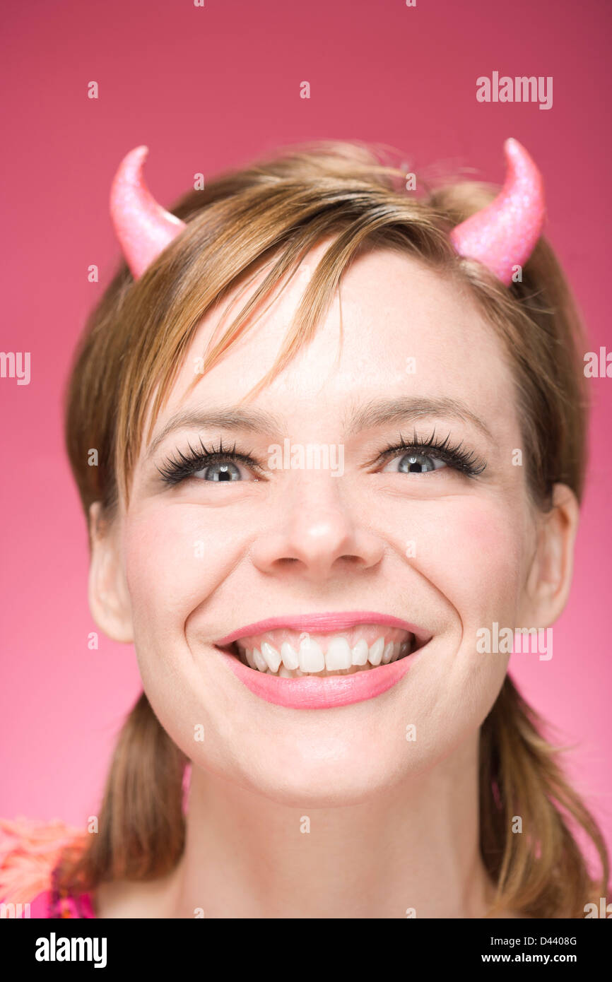 Portrait of Woman Wearing Devil Horns Stock Photo - Alamy