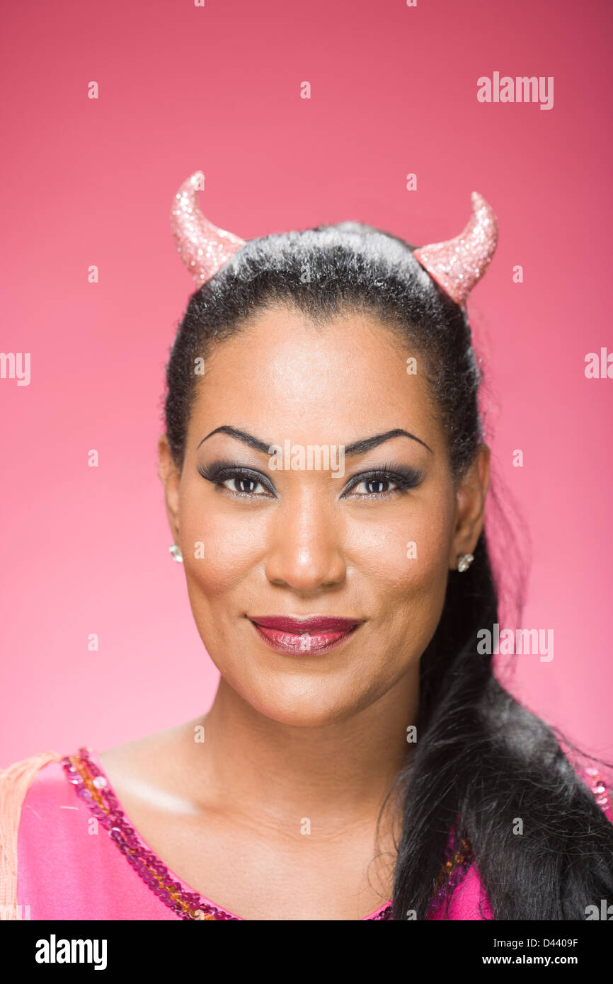Portrait of Woman Wearing Devil Horns Stock Photo - Alamy