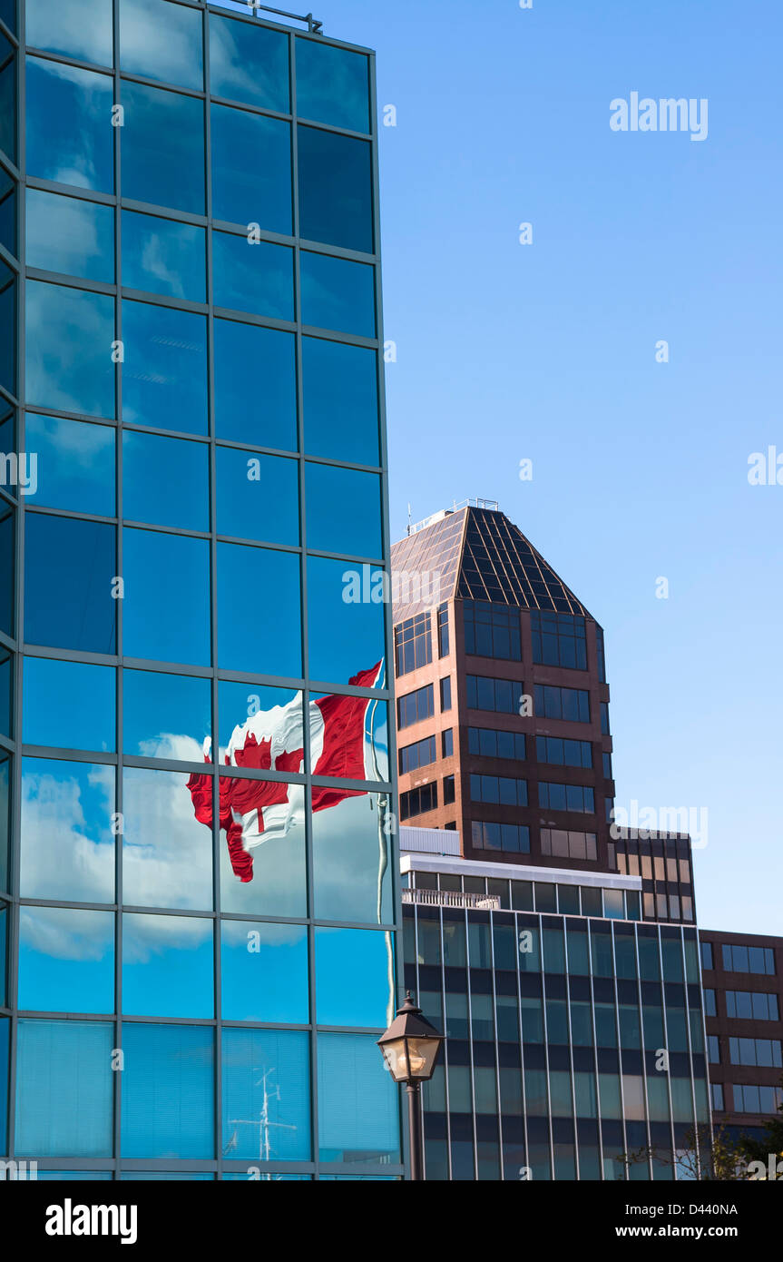 Close-up of Office Towers with Sky and Canadian Flag Reflected on ...