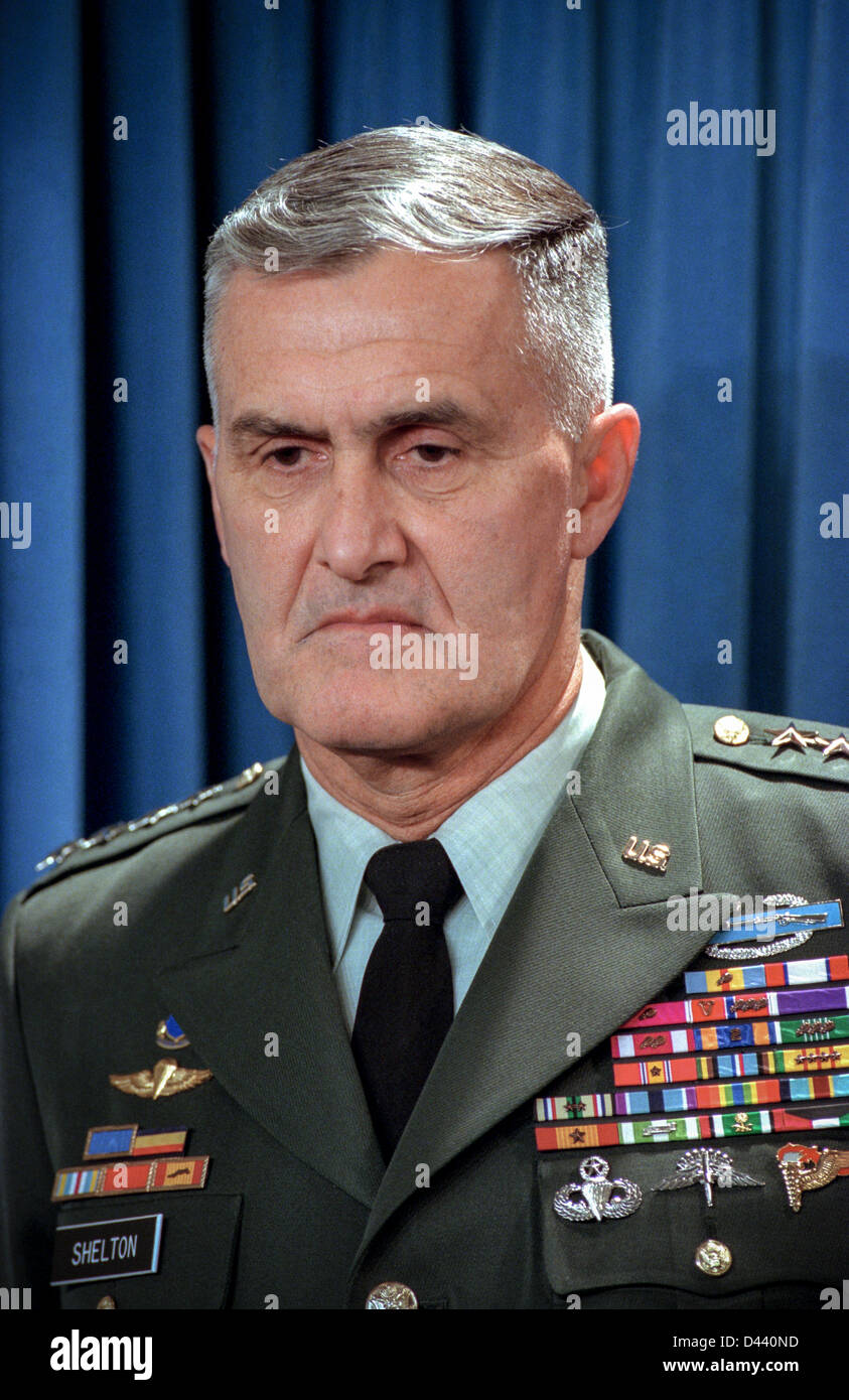 US Joints Chief General Hugh Shelton looks on as President Bill Clinton ...