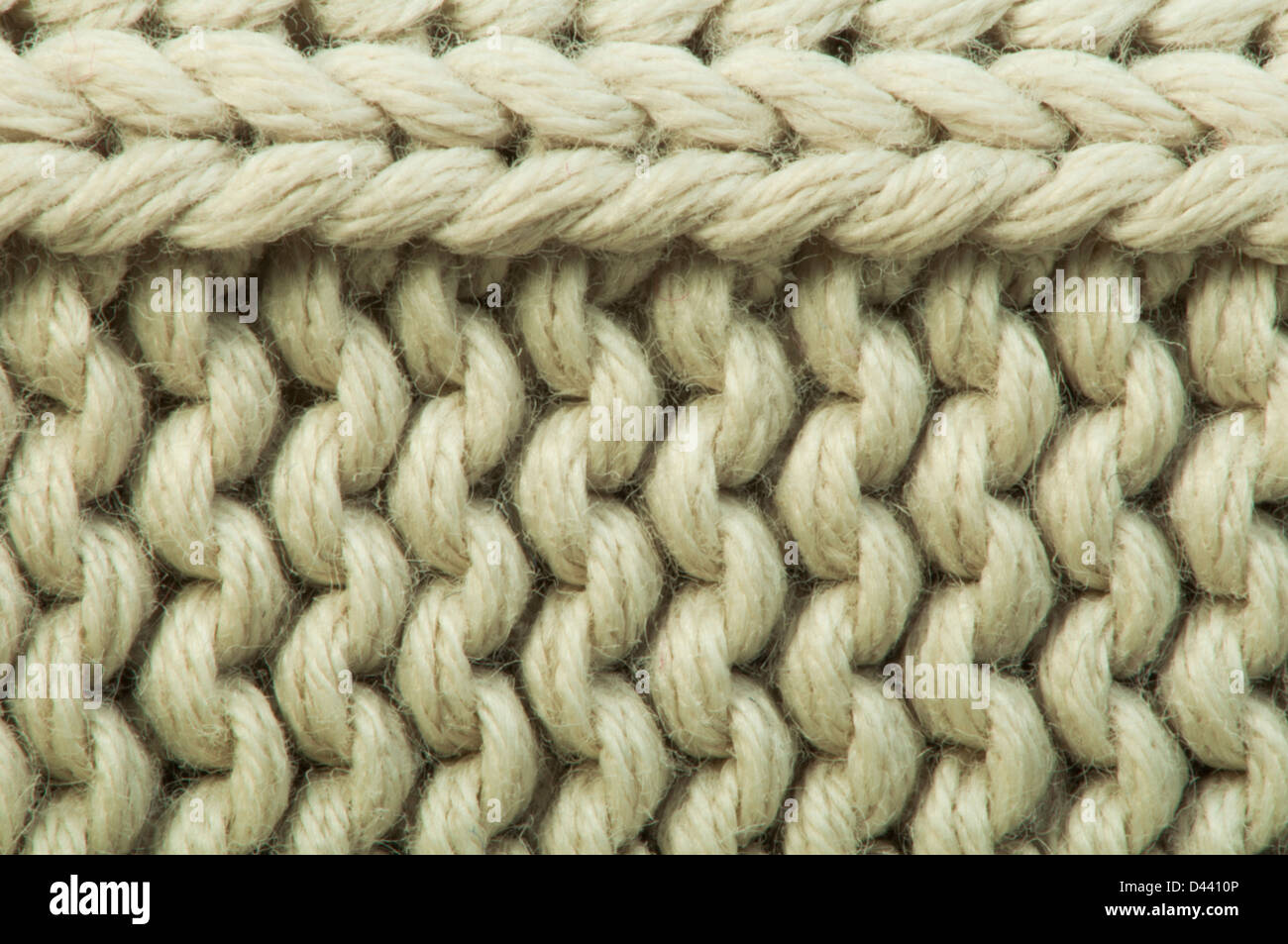 Old knit sweater background. Beige color. Studio shot Stock Photo - Alamy