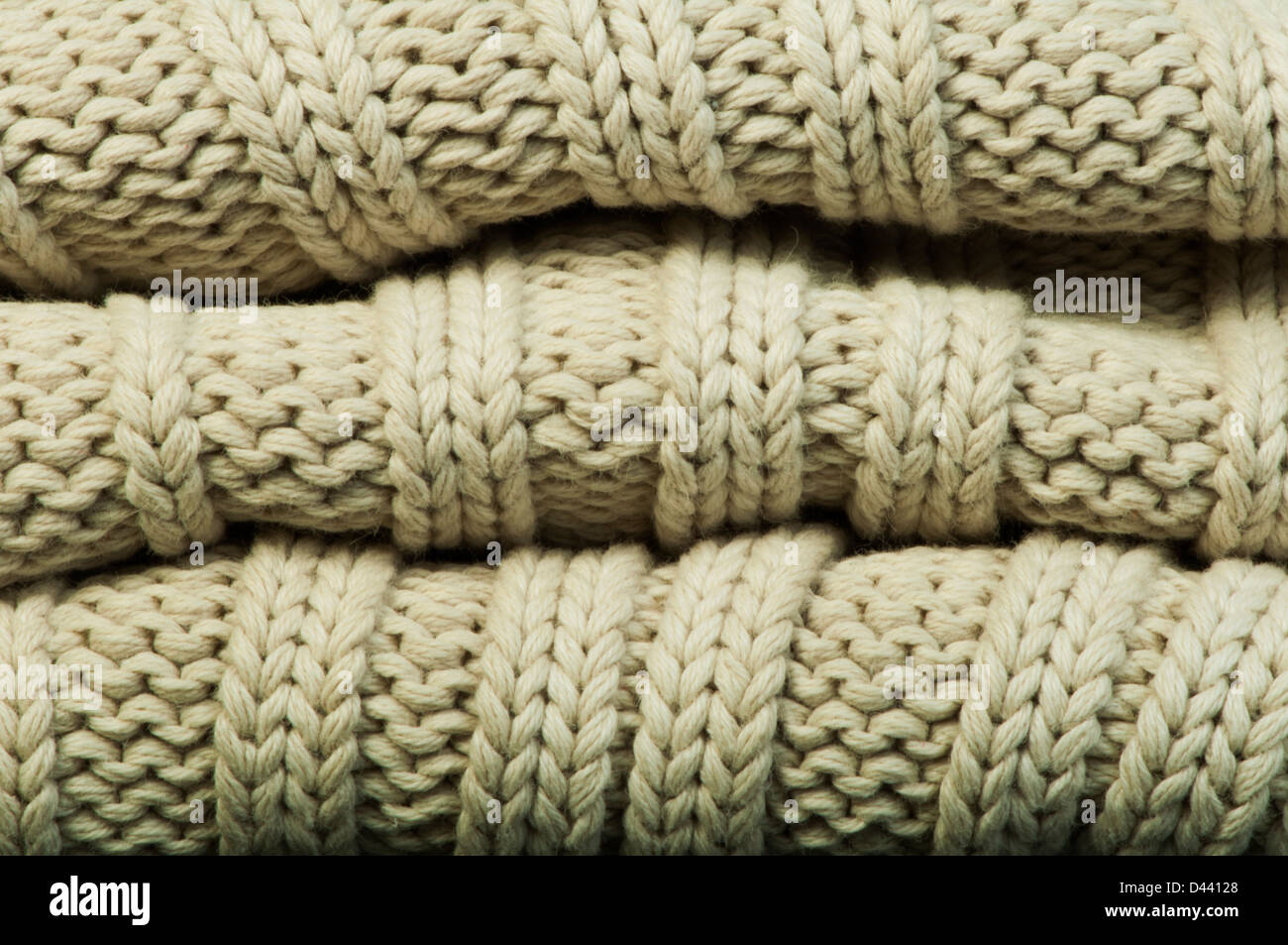 Old knit sweater background. Beige color. Studio shot Stock Photo - Alamy