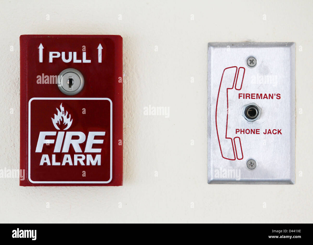 Fire alarm switch over a sign showing a fire and text fire alarm on a ...