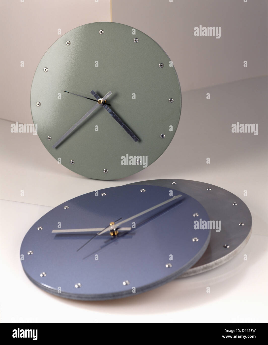 Close-up of circular metal clock faces Stock Photo - Alamy