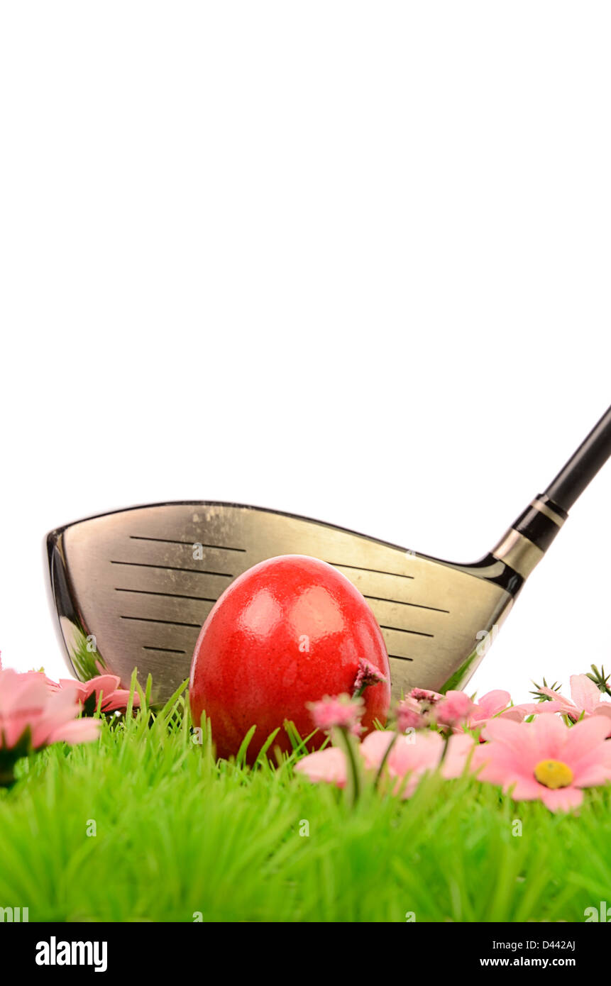 Red Easter egg on a green meadow with a golf club Stock Photo - Alamy
