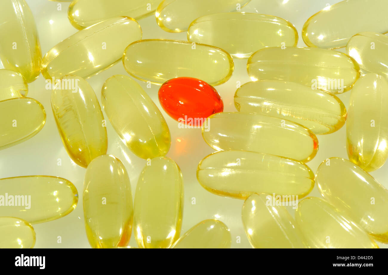 Fish oil capsules closeup on white background Stock Photo - Alamy