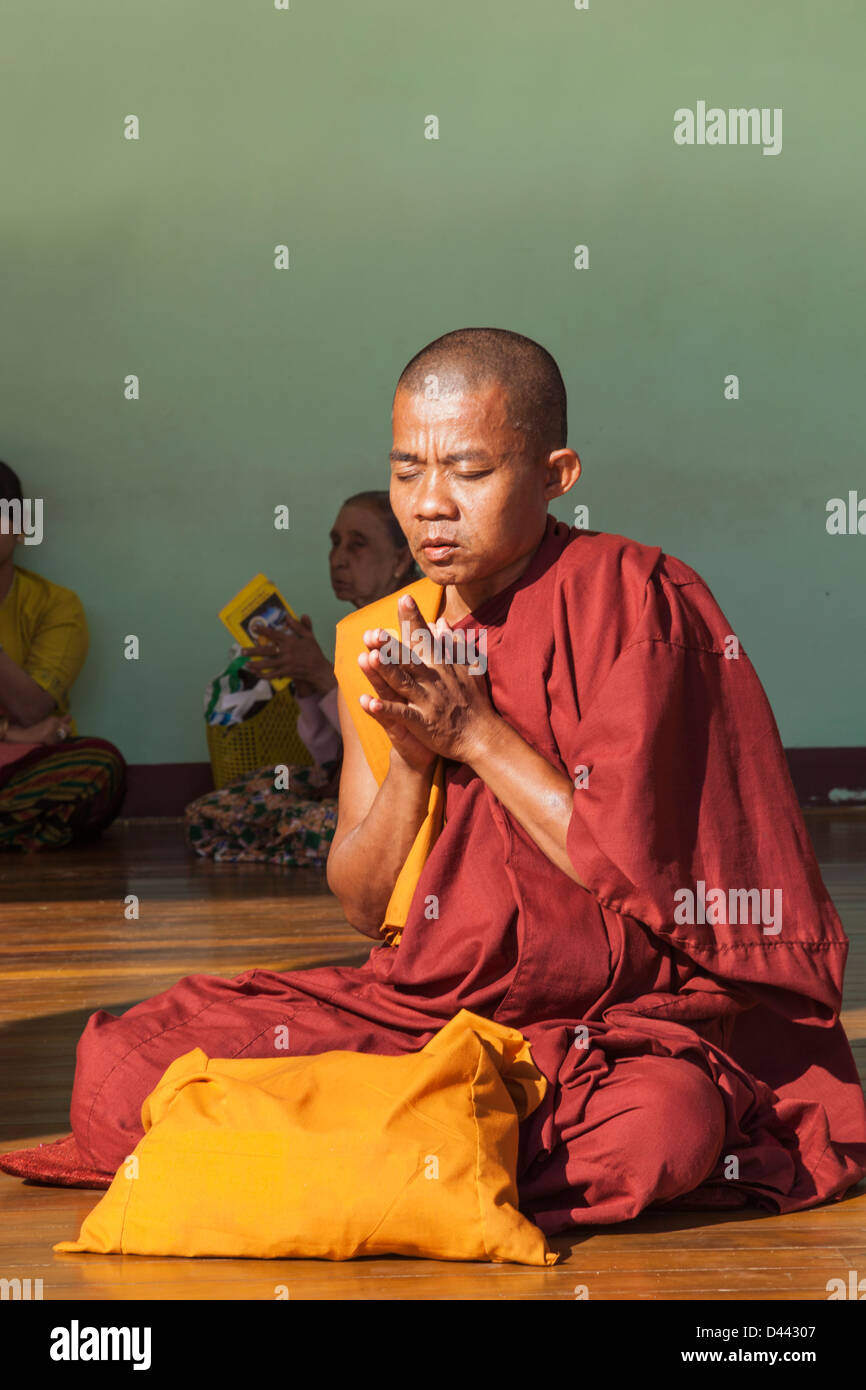 Myanmar, Yangon, Shwedagon Pagoda, Buddhist Monk Praying Stock Photo ...