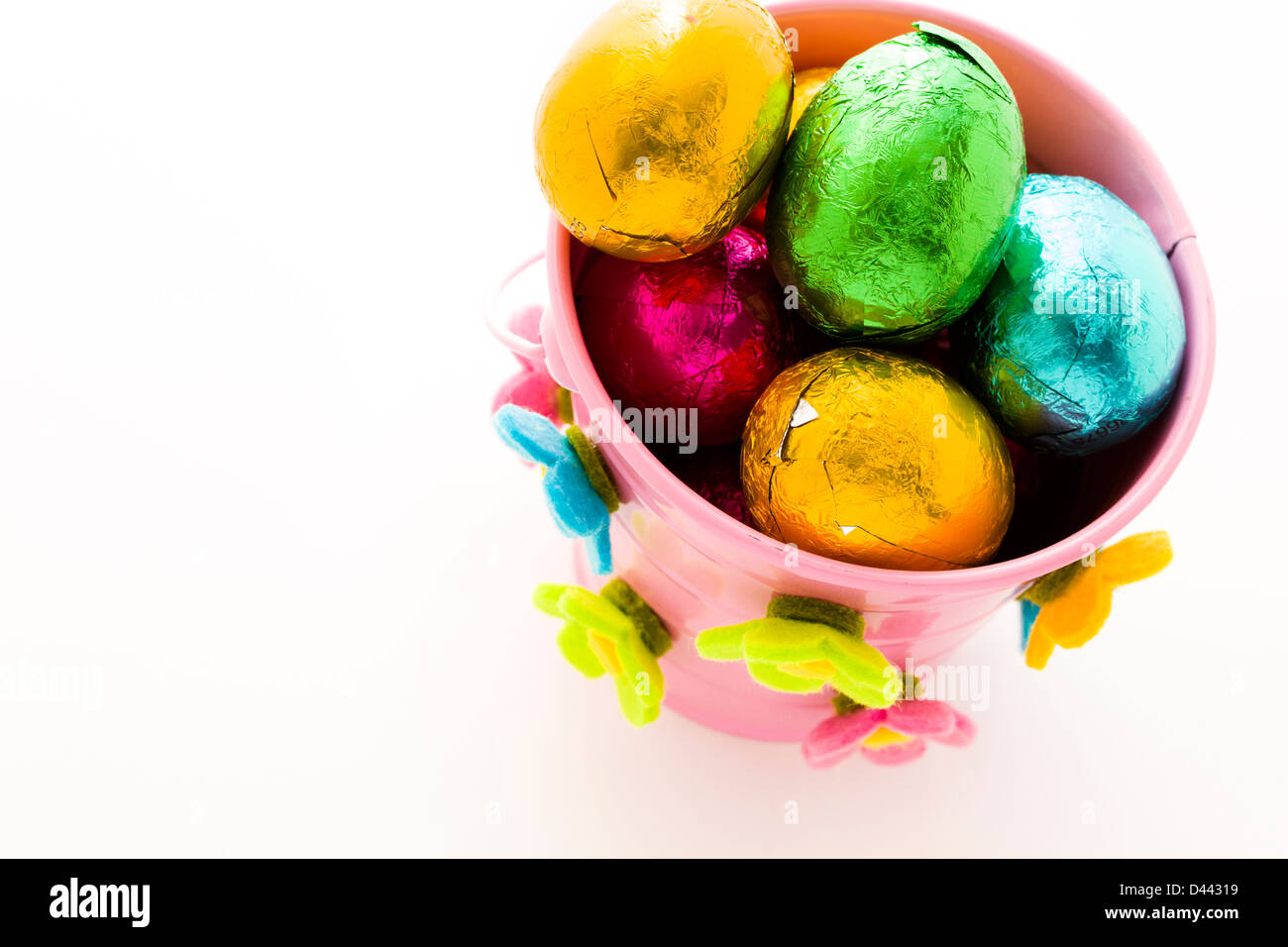 Chocolated Easter eggs wrapped in colorful foils Stock Photo - Alamy
