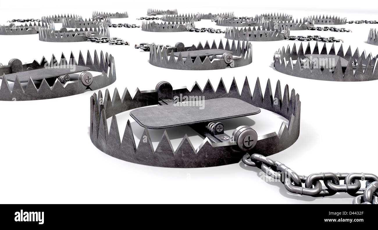 A collection of randomly set out metal animal traps attached to the ...