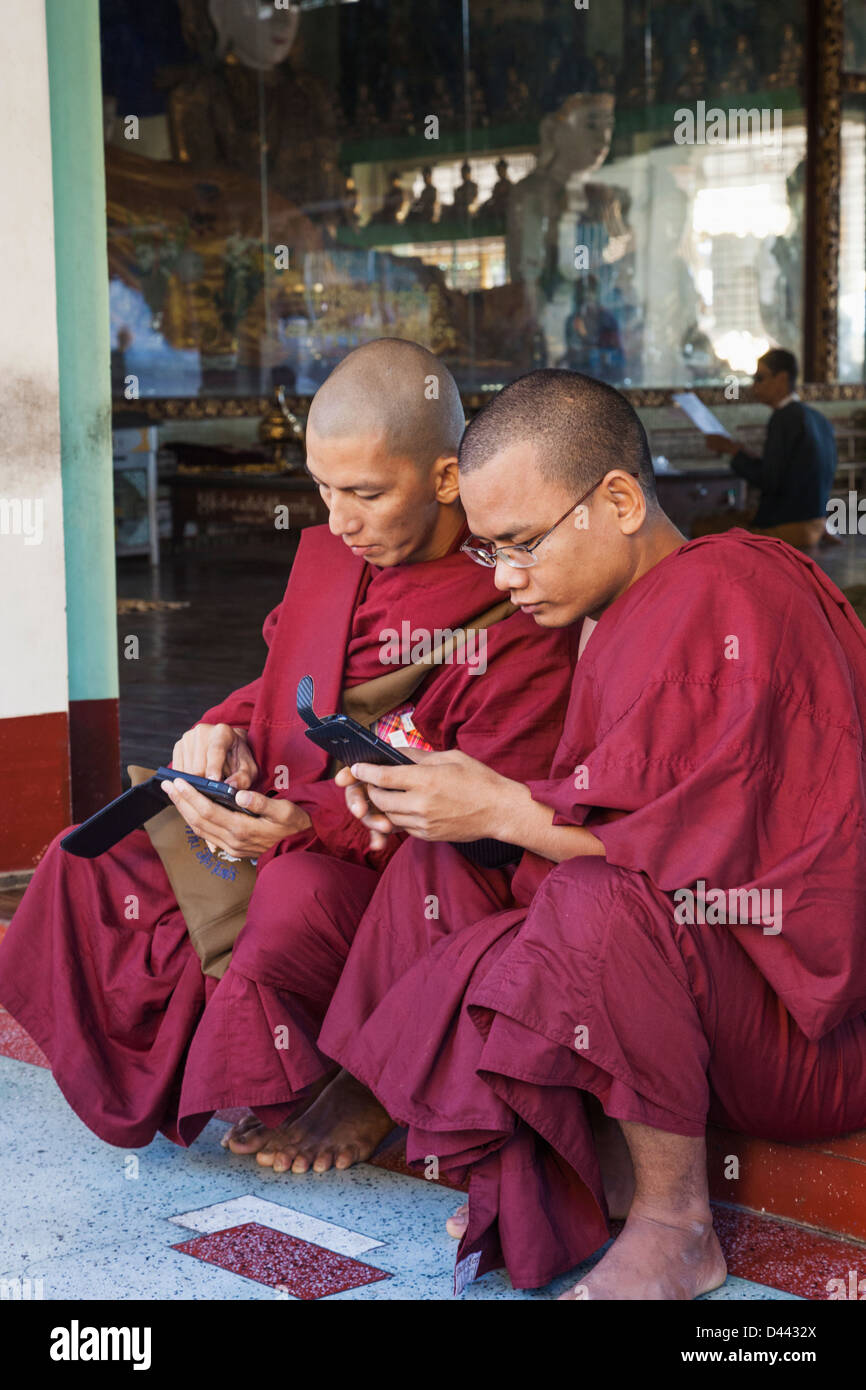 Myanmar, Yangon, Shwedagon Pagoda, Monks with Mobile Phones Stock Photo ...