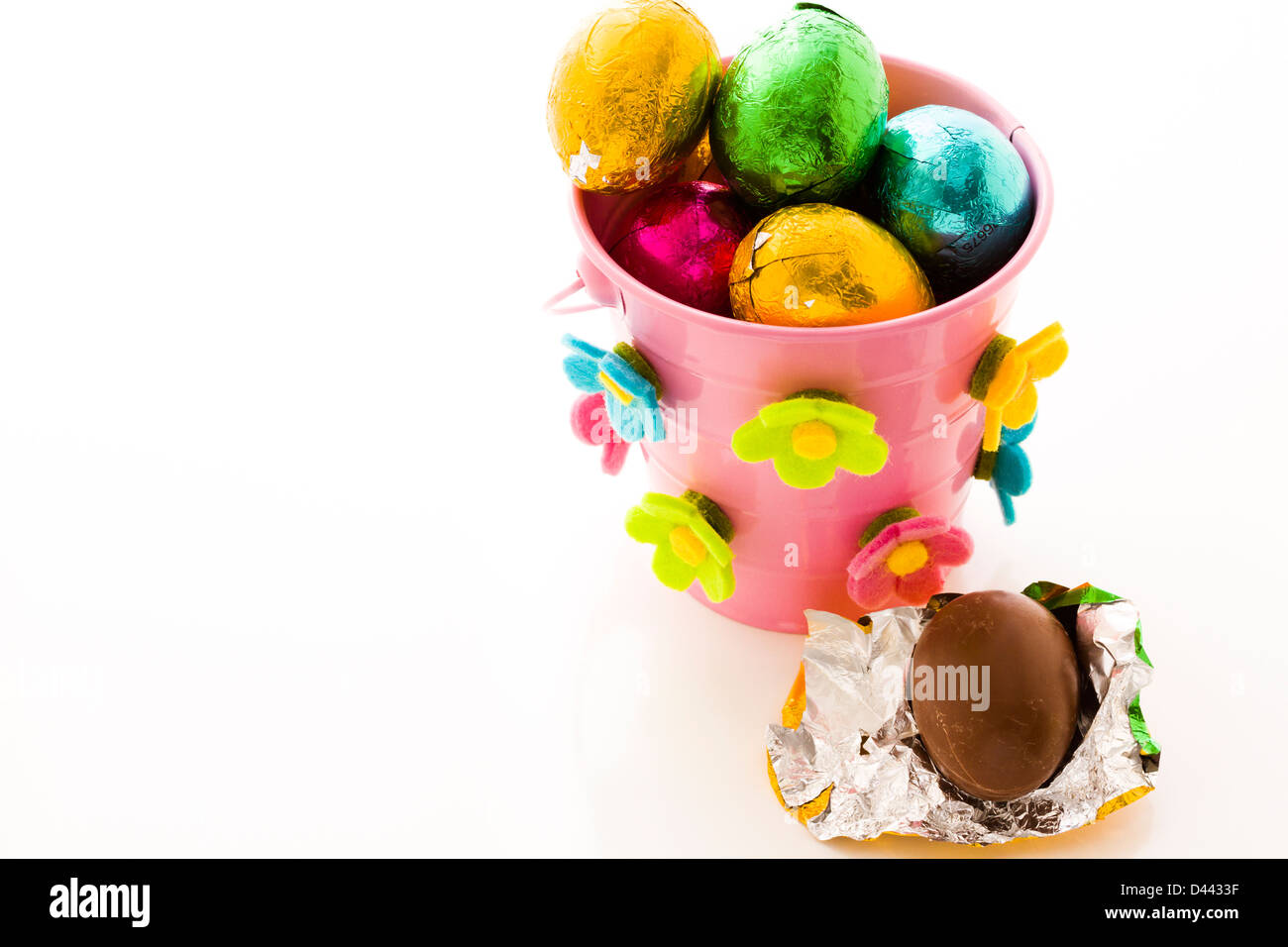 Chocolated Easter eggs wrapped in colorful foils Stock Photo - Alamy