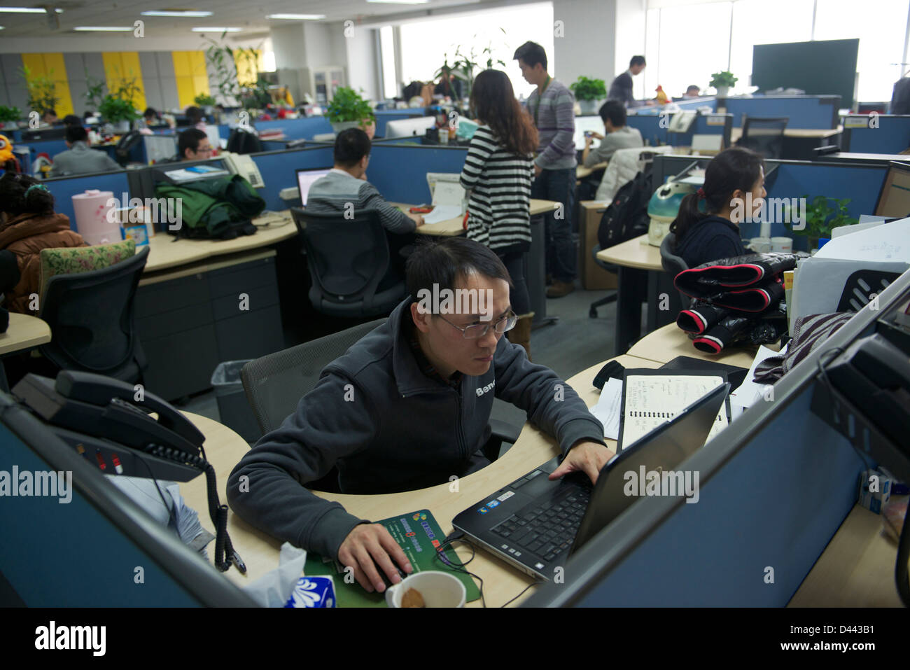 Chinese editors work at Sina's Weibo microblog office in Beijing, China ...