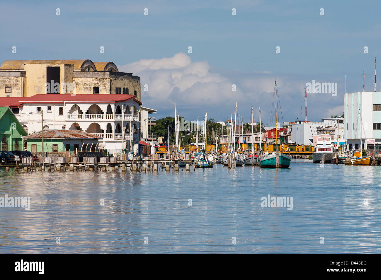 Many sailboats docked in the harbor of a colorful port on Belize Stock ...