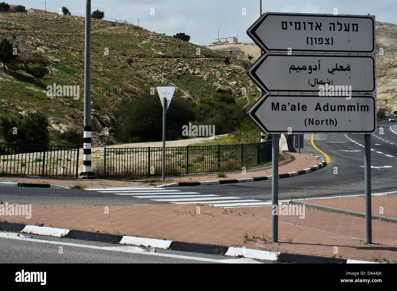 Signs indicate one of the entrances to Maale Adumim in Hebrew, Arabic ...