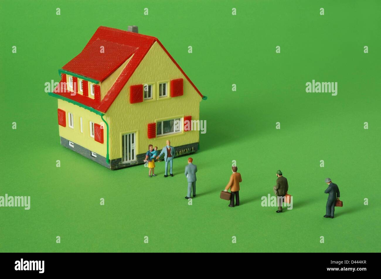 Illustration - A miniature house is pictured with the miniature figures ...