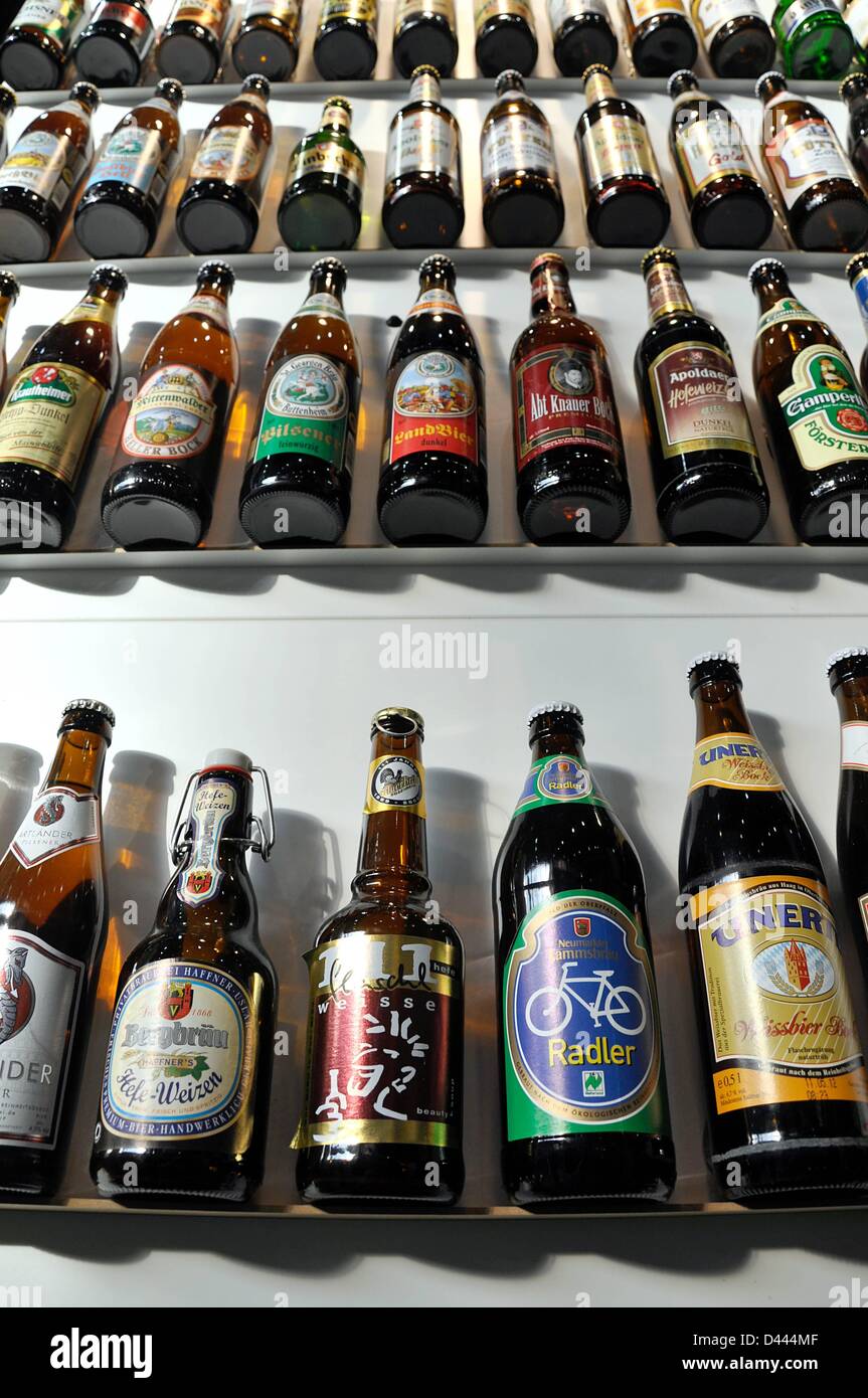 Beer bottles of different types are pictued in a shelf at the ...