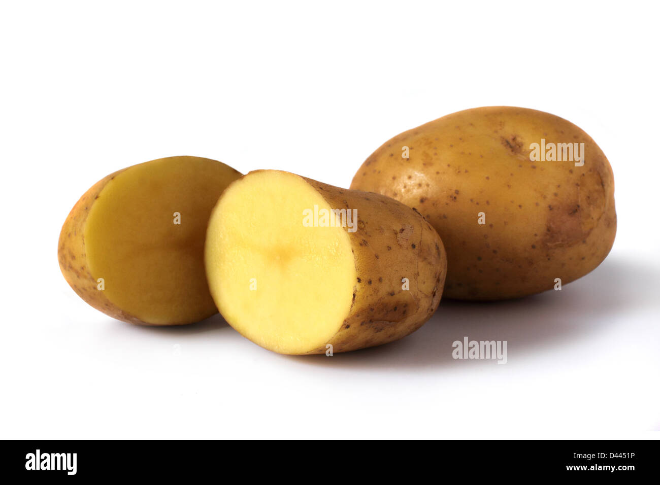two halves of potatoes and one whole isolated on white Stock Photo - Alamy