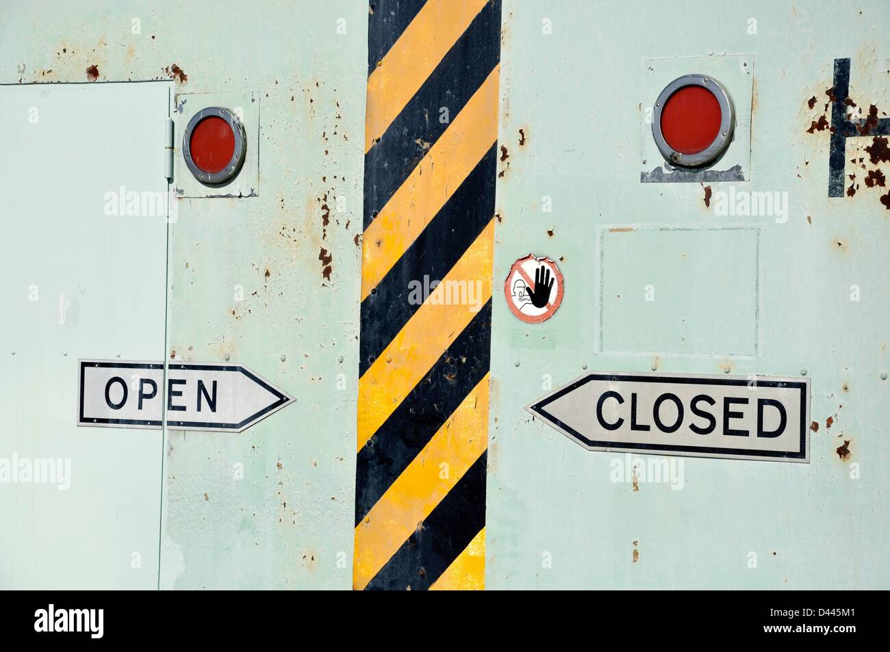 Two arrows reading "Open" and "Close" are pictured on a hangar's gate ...