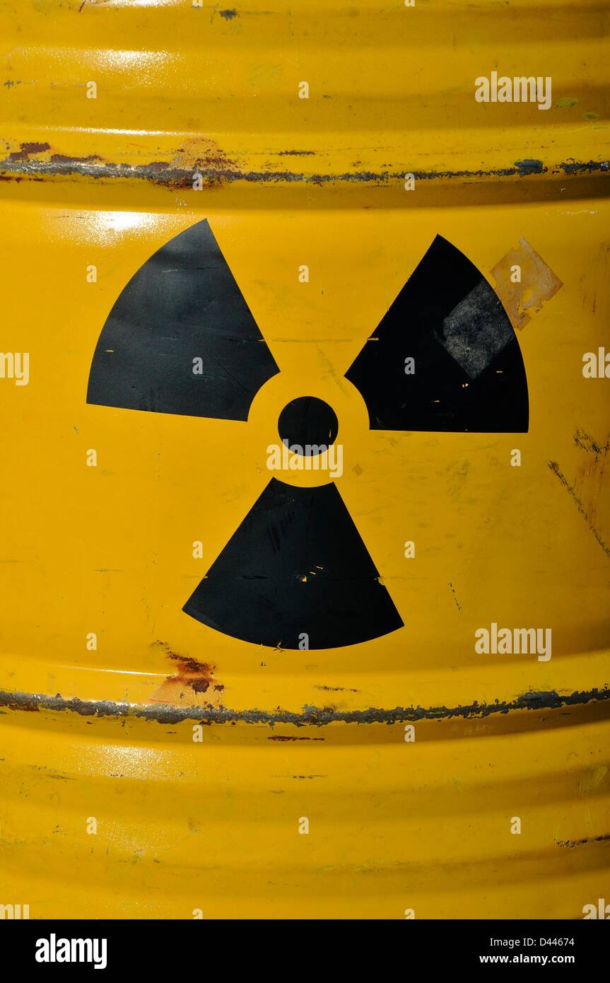 A barrel with the trefoil symbol indicating radiactive material is ...