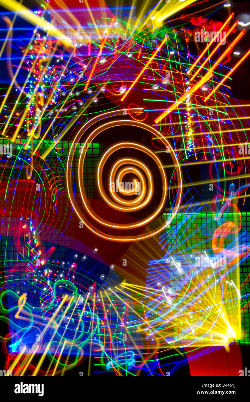 Long exposure photograph of handheld light sources being moved in front ...