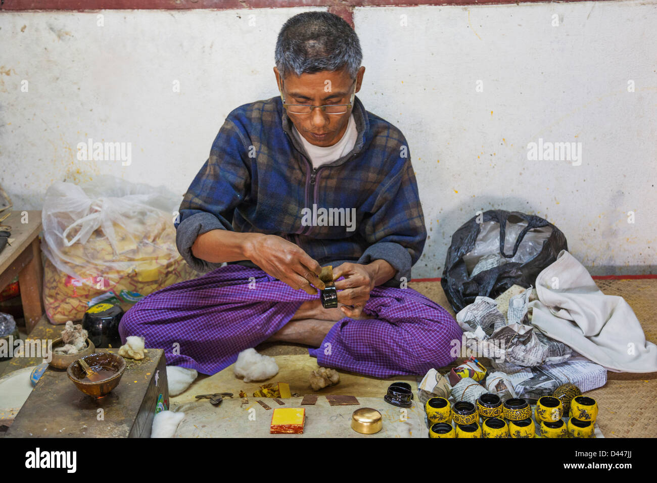Myanmar, Bagan, Lacquerware Maker Applying Gold Leaf Stock Photo - Alamy