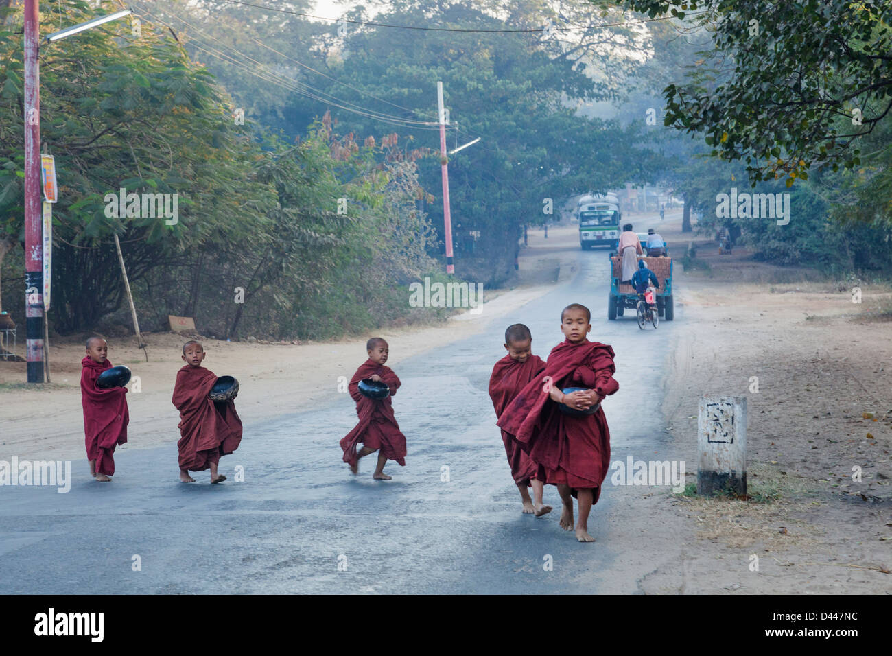 Myanmar, Bagan, Young Monks Crossing Road Stock Photo - Alamy