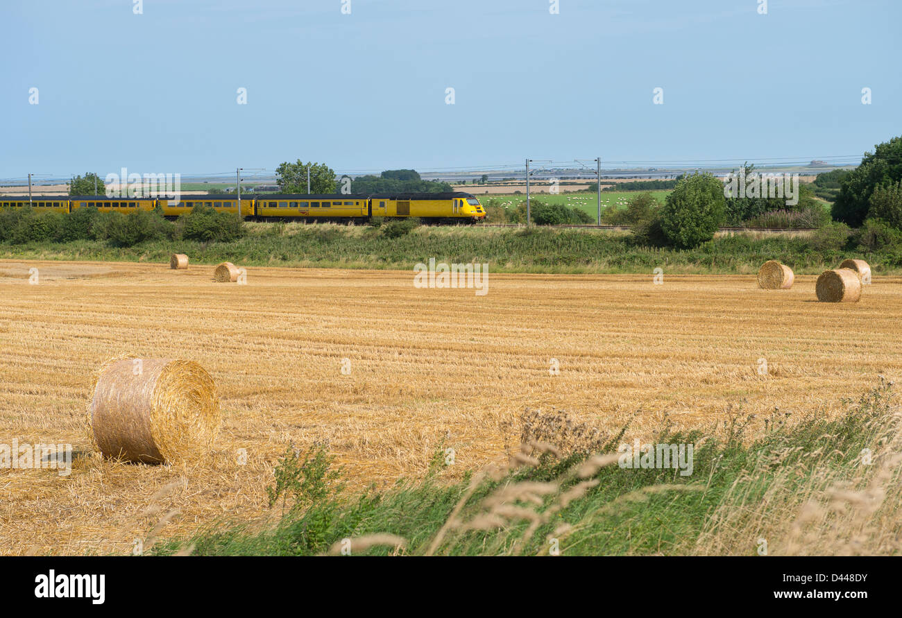 Yellow Network Rail maintenance train travelling through the beautiful ...