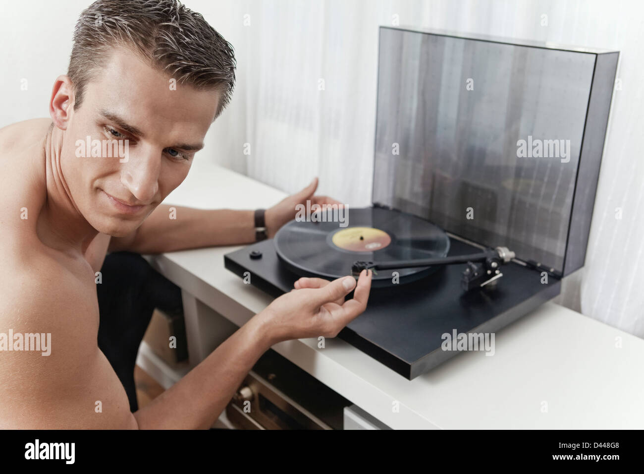 Man playing vinyl record music on turntable Stock Photo - Alamy