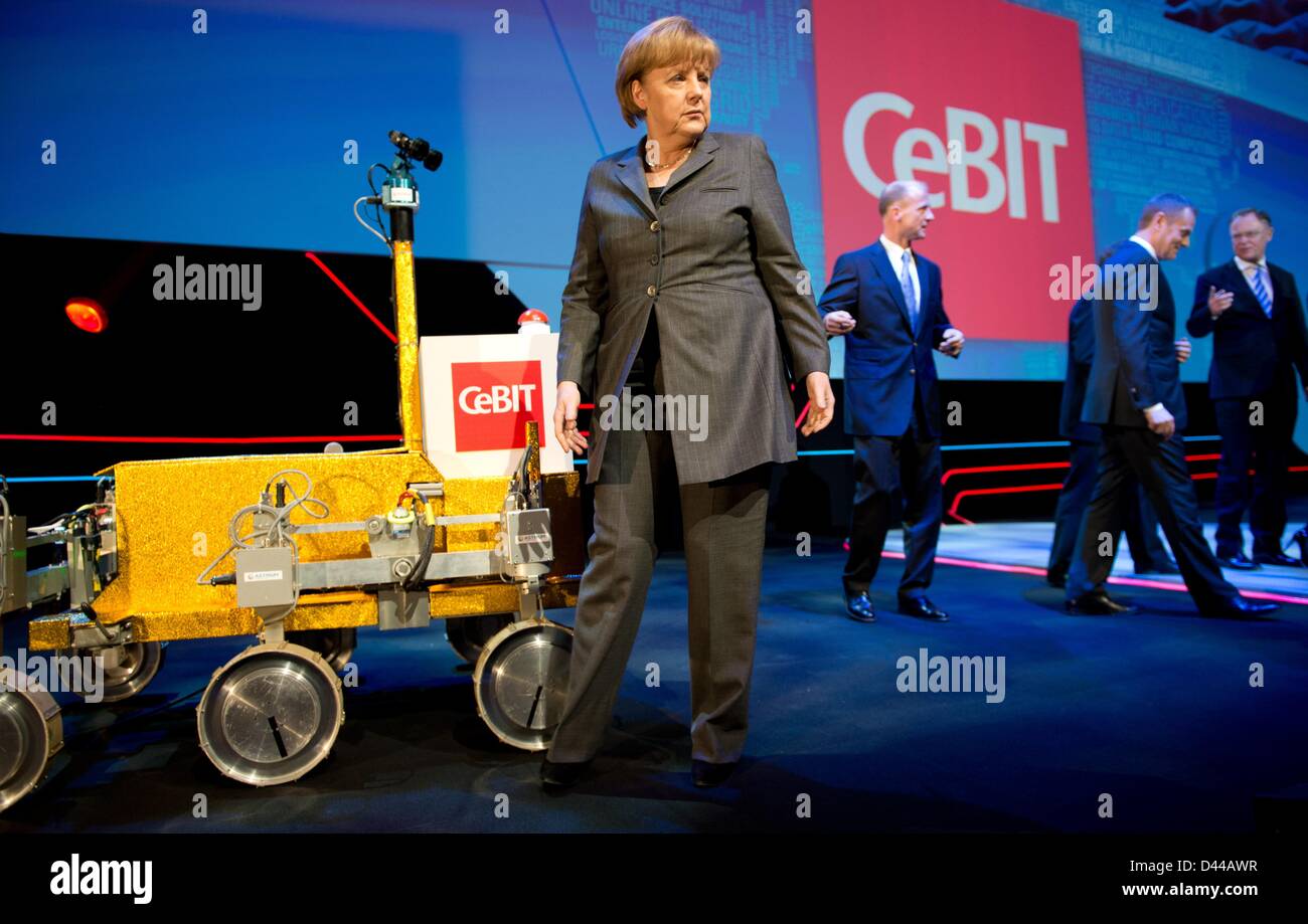 German Chancellor Angela Merkel stands in front of the Mars rover ...