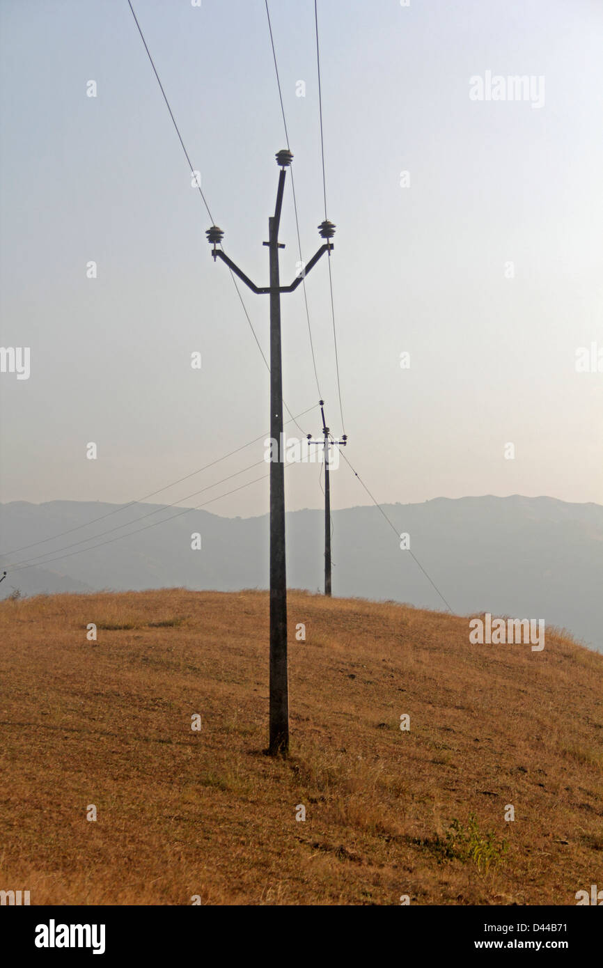 Communication tower and power line, India Stock Photo - Alamy