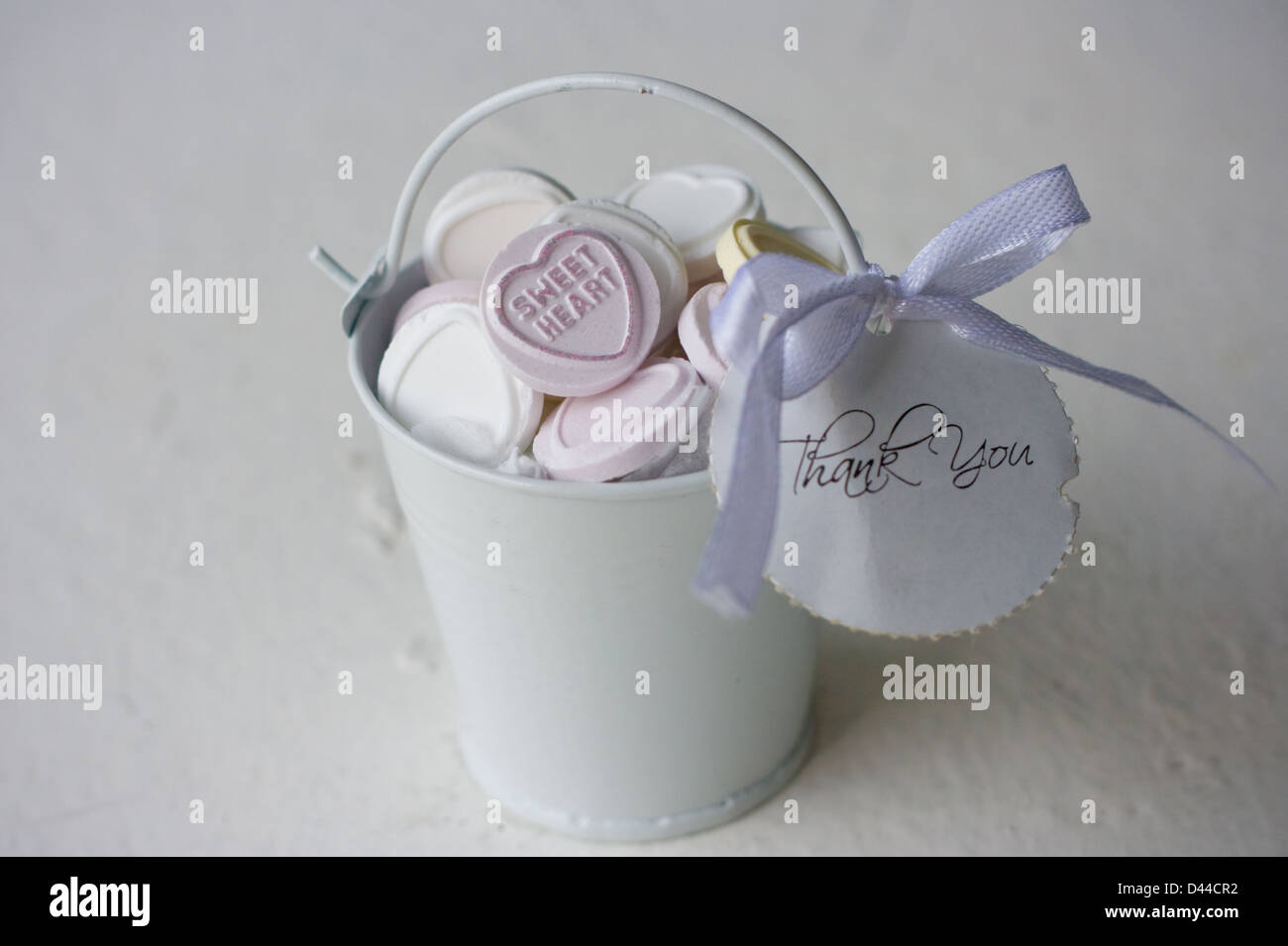 Little bucket of love heart sweets with a thank you note and ribbon ...