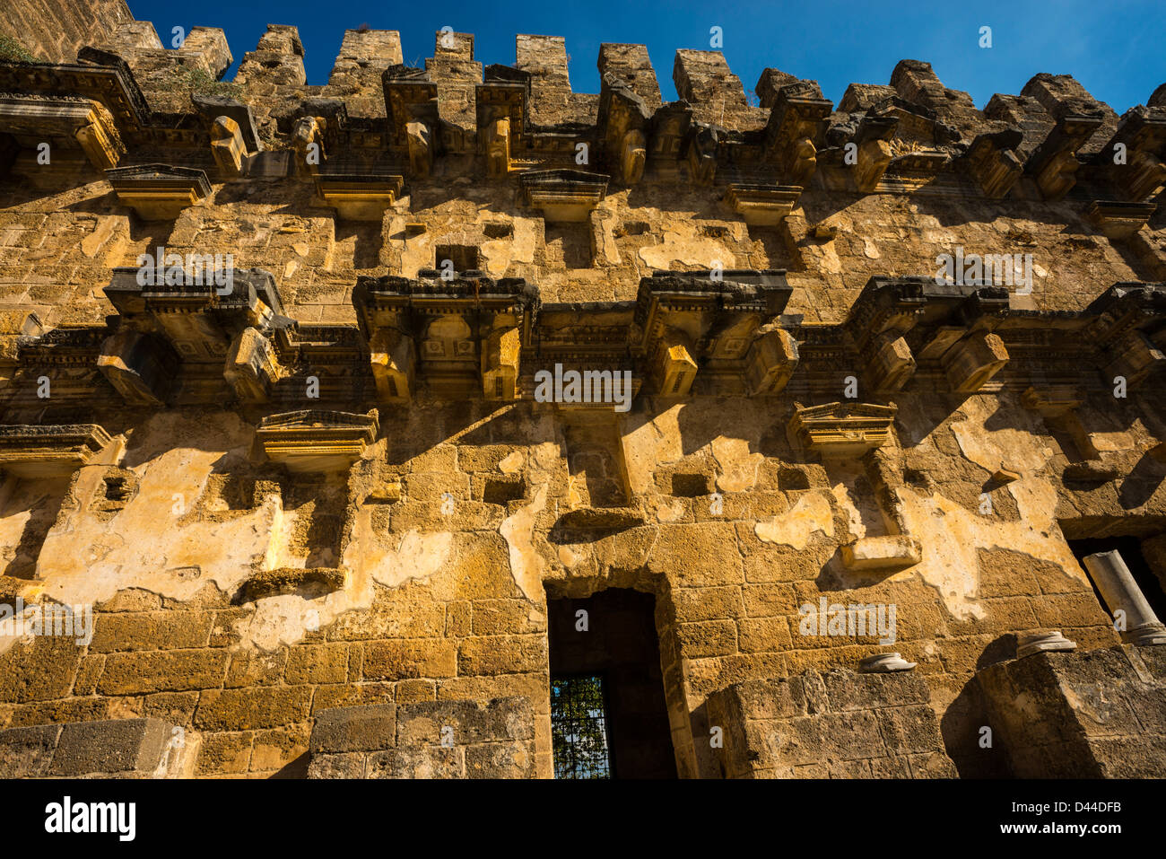 The back wall of the stage at the roman theatre at Aspendos which once ...