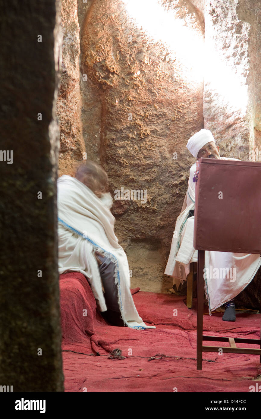 Two priests inside rock hewn church Lalibela, Ethiopia Africa Stock ...